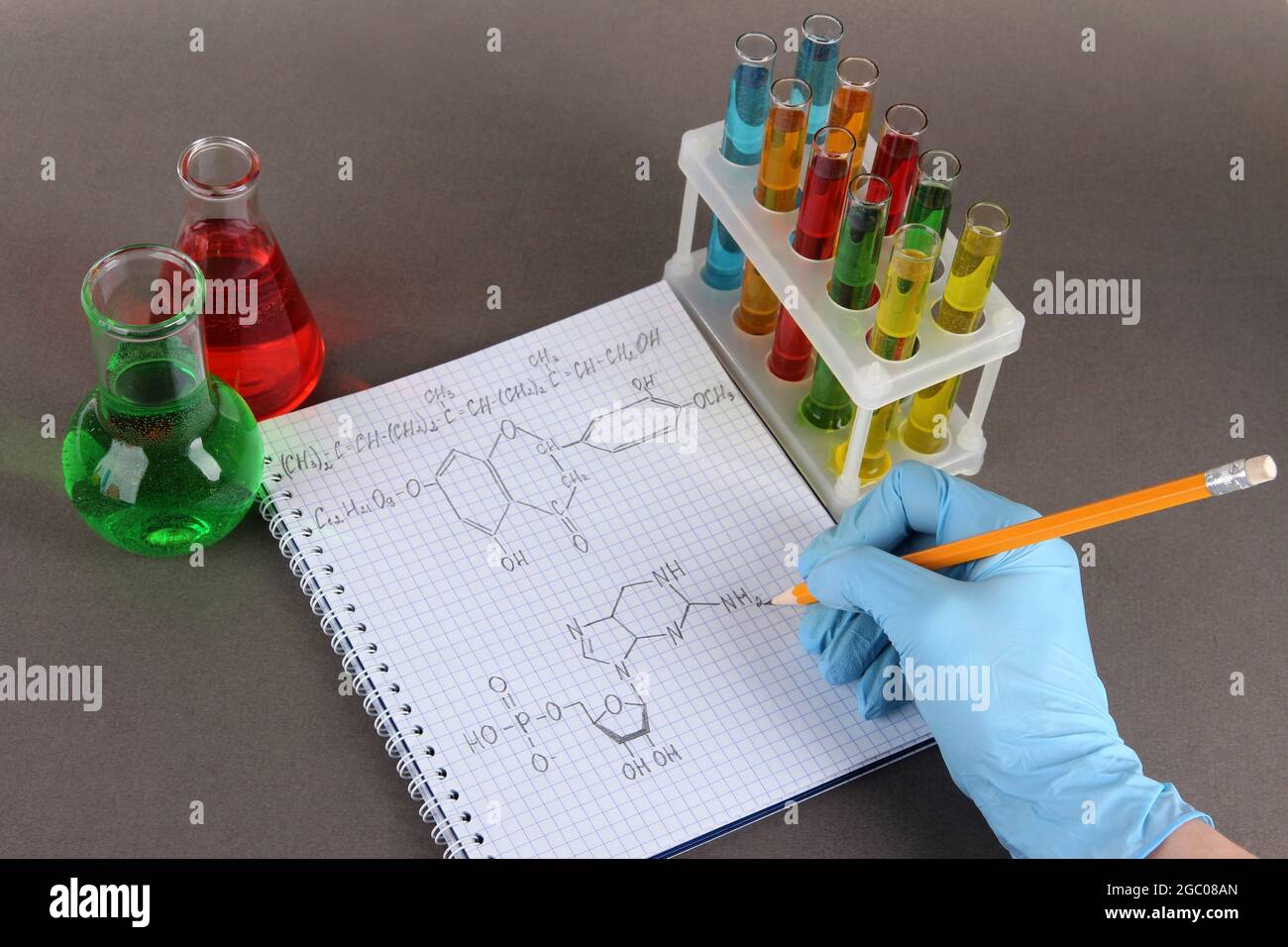 Hand scientist writing formulas Stock Photo - Alamy