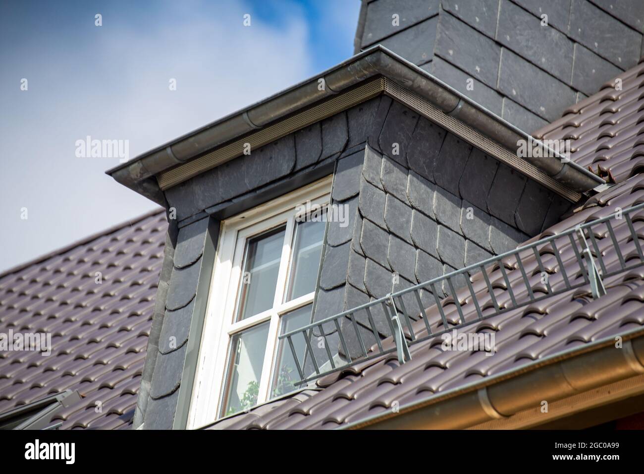 Slate cladded dormer on a new tiled roof Stock Photo - Alamy