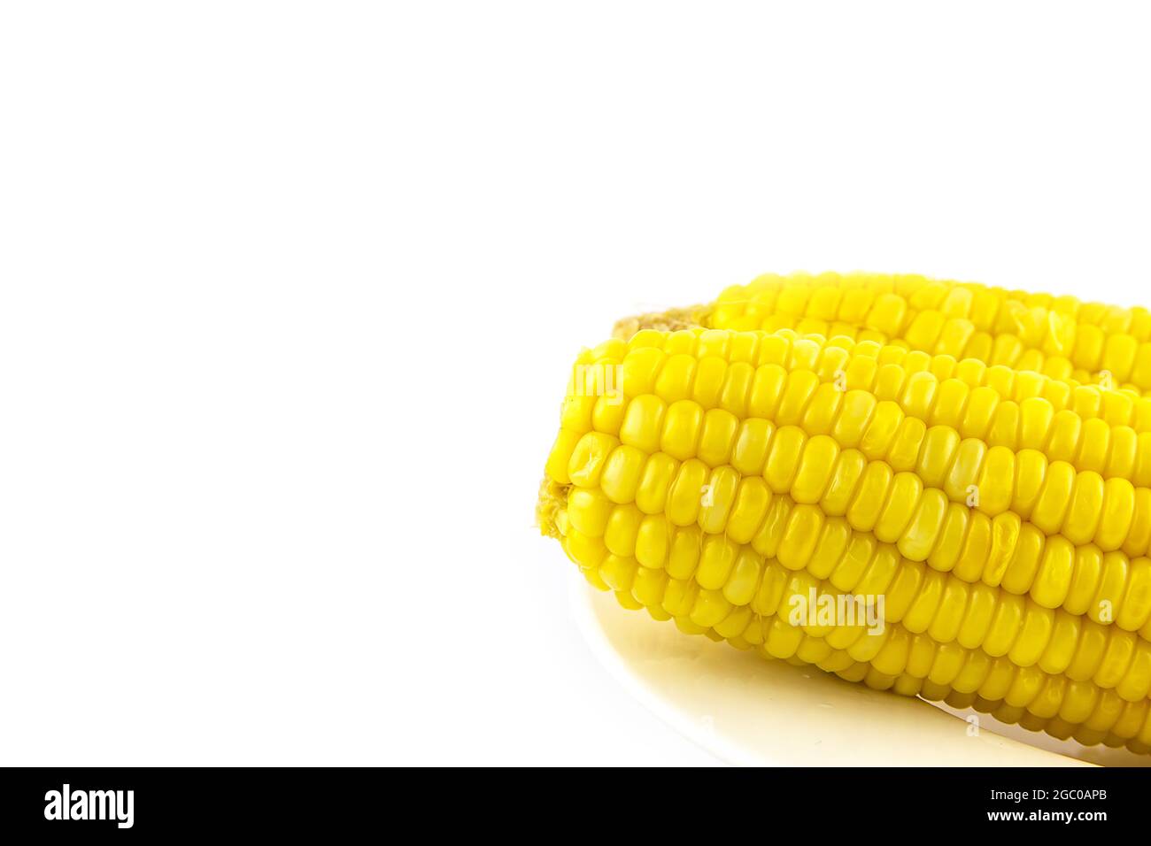 Boiled yellow corn cobs isolated on white background Stock Photo - Alamy