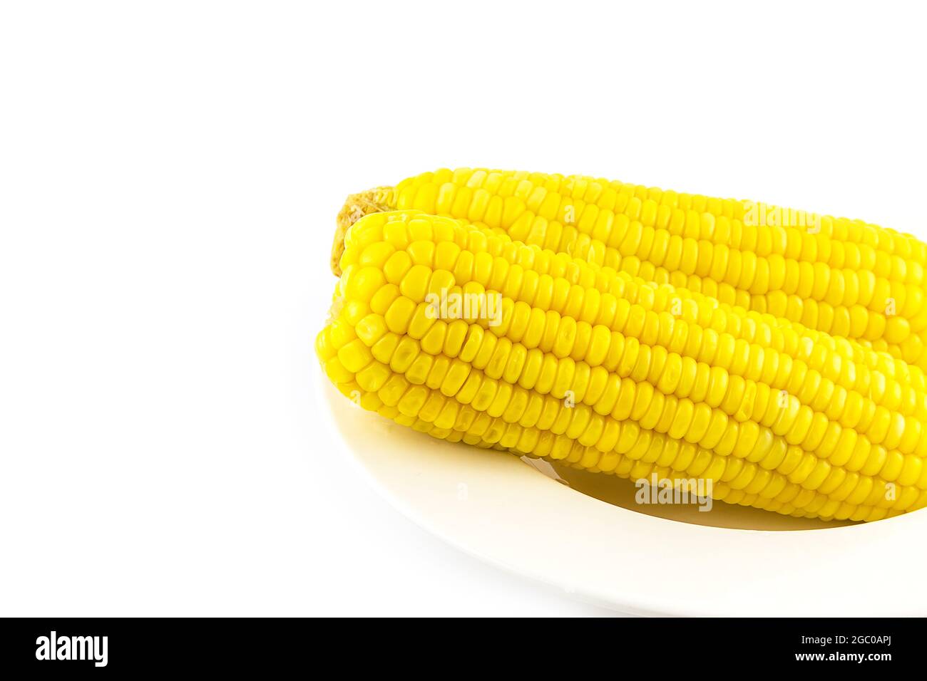 Boiled yellow corn cobs isolated on white background Stock Photo - Alamy