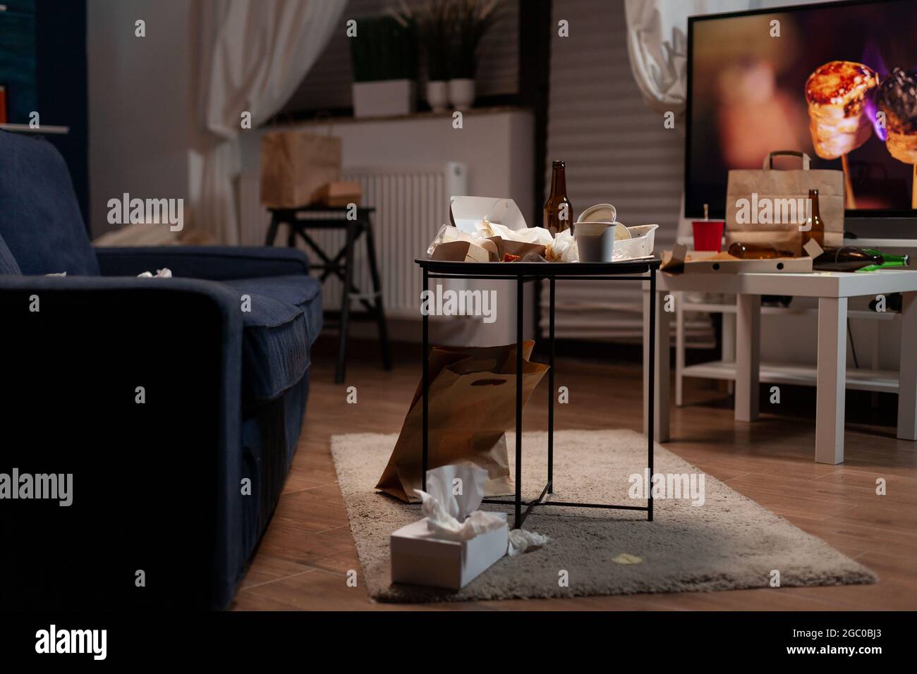 Garbage table with empty beer drink bottle and food rubbish placed in ...