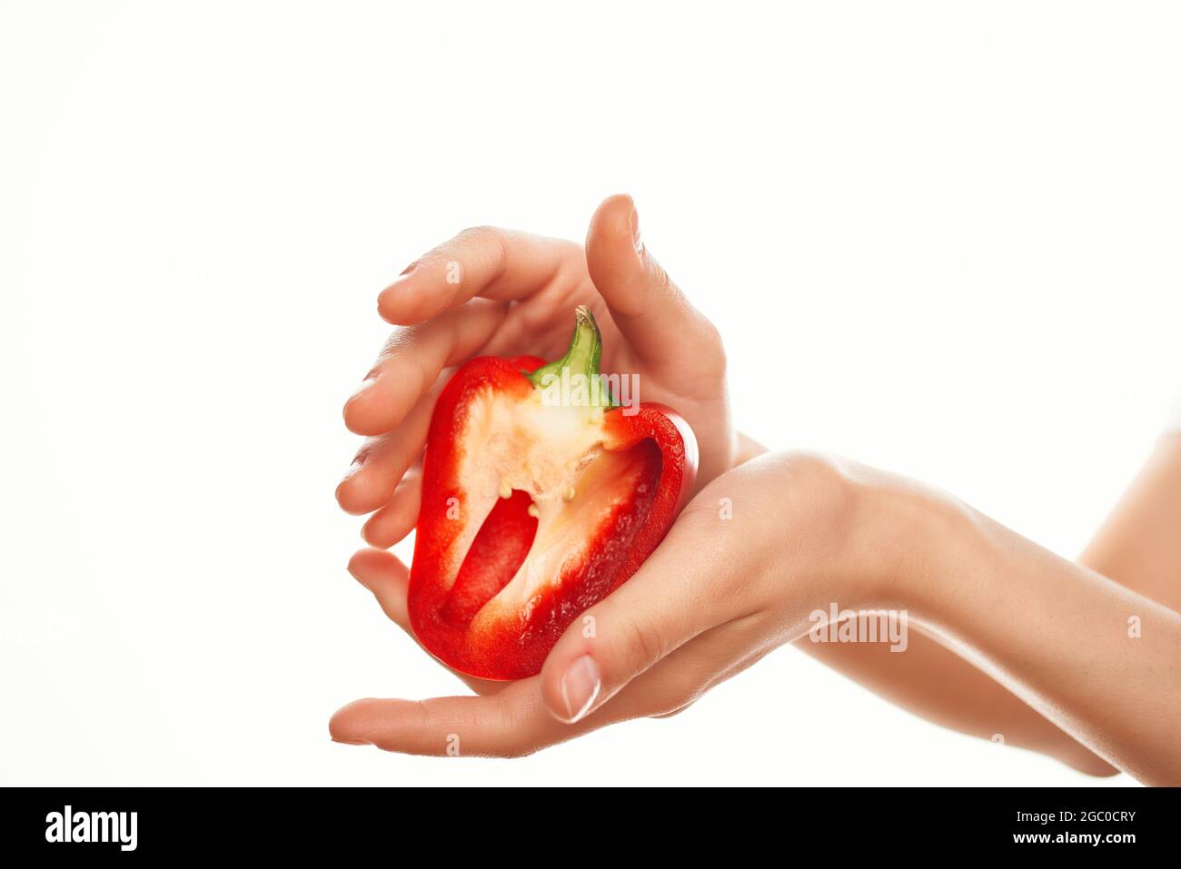 red pepper in hand ingredient healthy food vitamins Stock Photo - Alamy