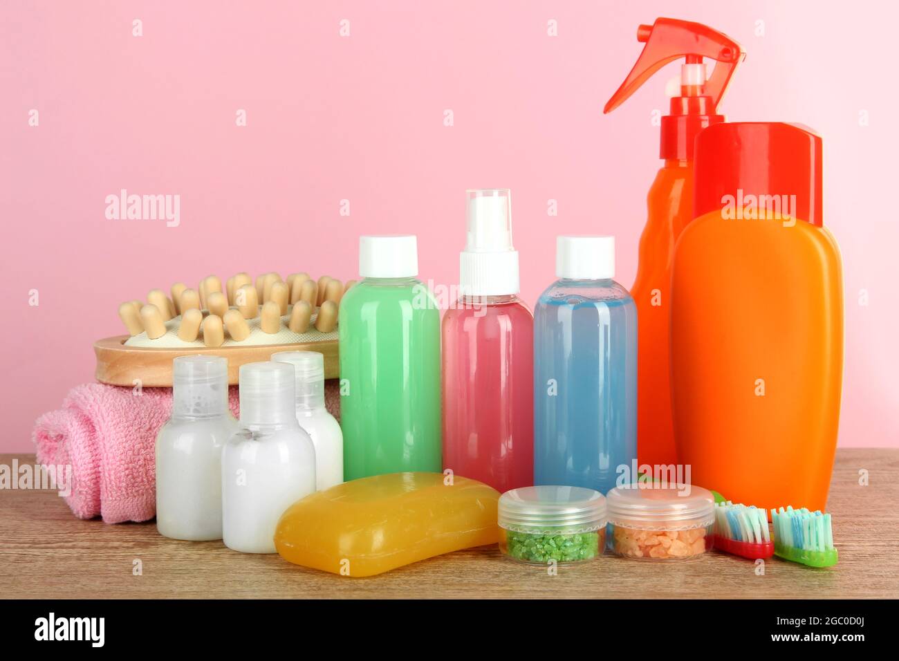 Hotel amenities kit on table on pink background Stock Photo - Alamy
