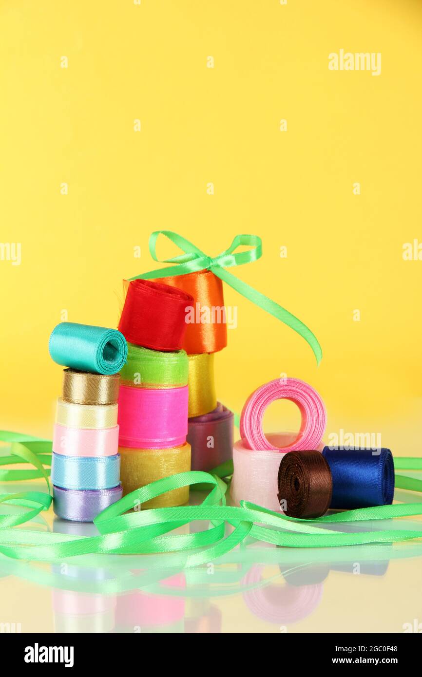 Many bright ribbons of different sizes on light background Stock Photo ...