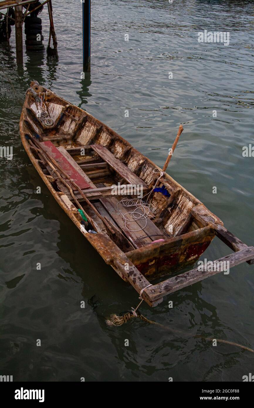 Wooden rotten rowboat in Penang, Malaysia Stock Photo - Alamy