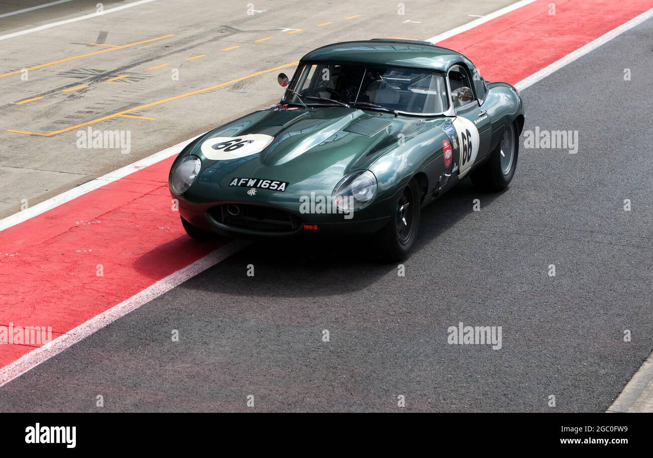 Niall McFadden driving his Jaguar-E-Type, in the pit lane before the ...