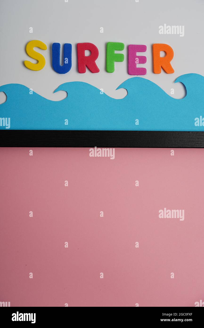 Word surface written in colored alphabets on a frame with a pink ...