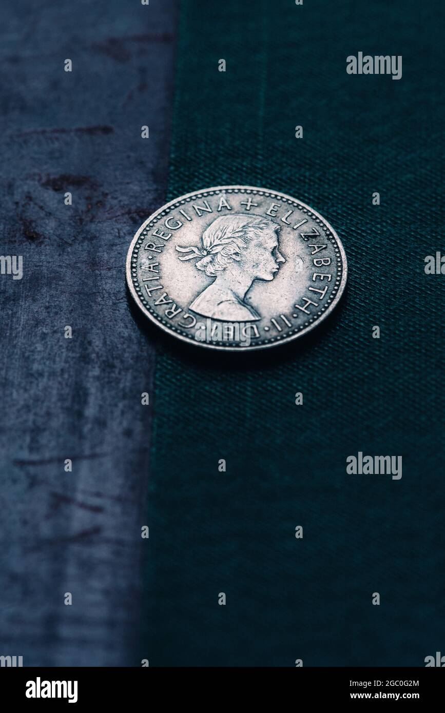 Closeup of an old English shilling on a dark background Stock Photo - Alamy