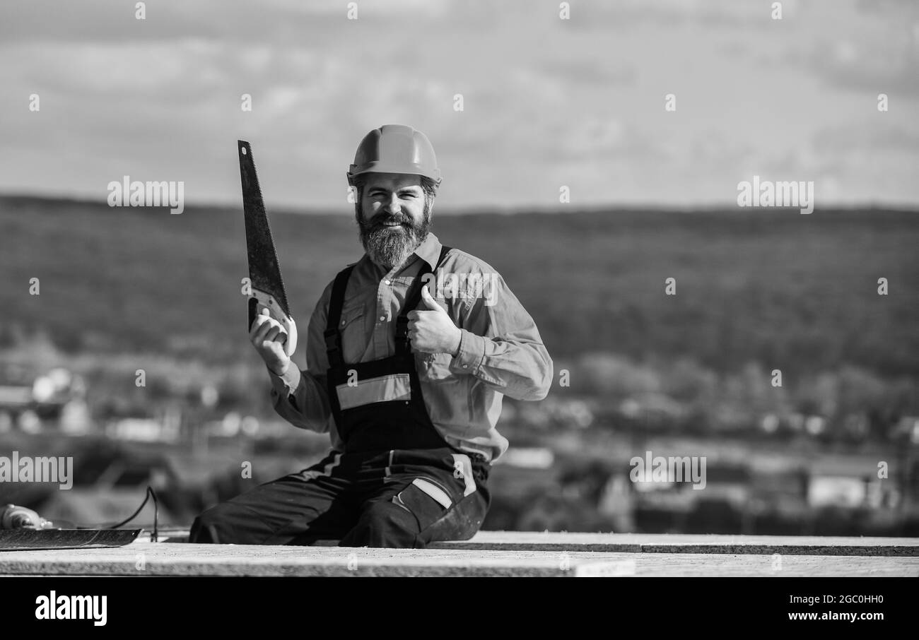 Construction carpentry. Man builder wear uniform and hard hat for ...