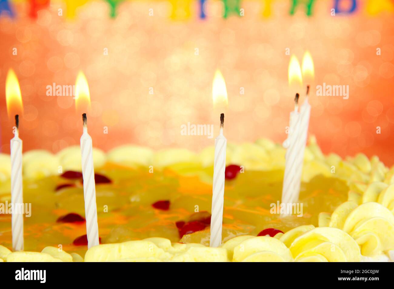 Happy birthday cake, on red background Stock Photo - Alamy