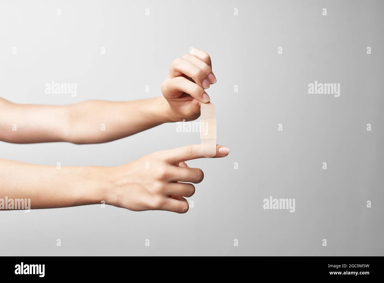 Doctor putting sticking plaster hi-res stock photography and images - Alamy