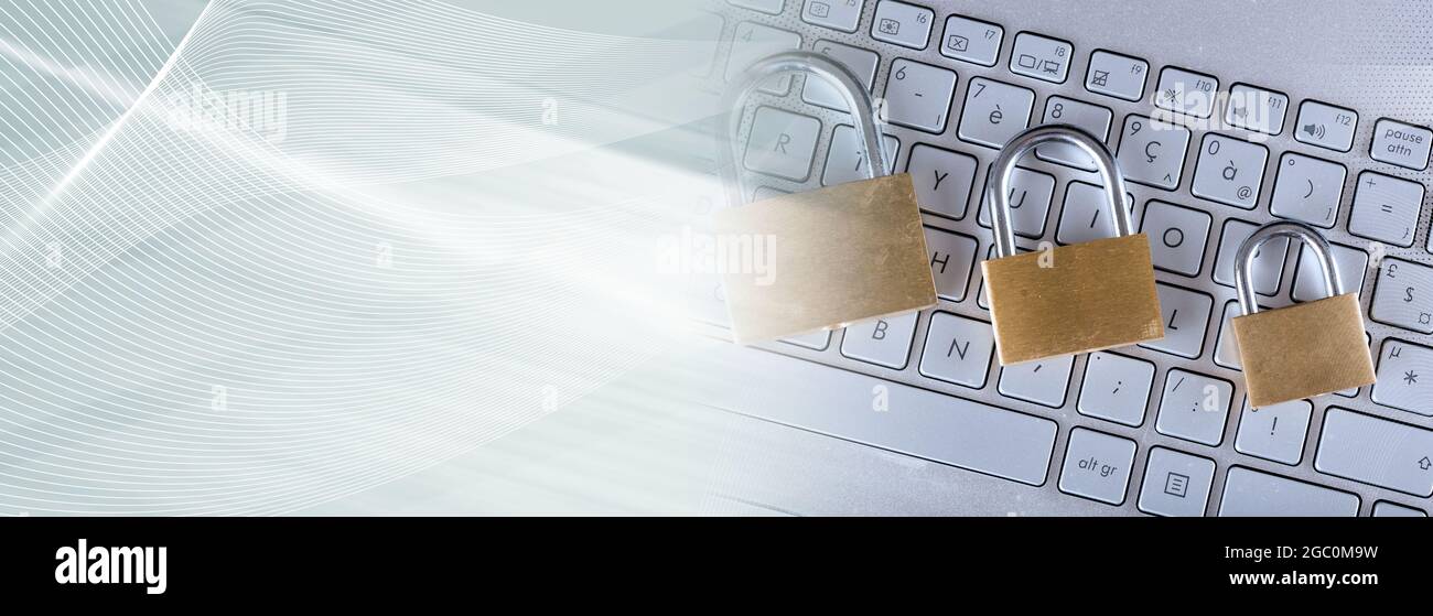 Padlocks on computer keyboard; panoramic banner Stock Photo - Alamy