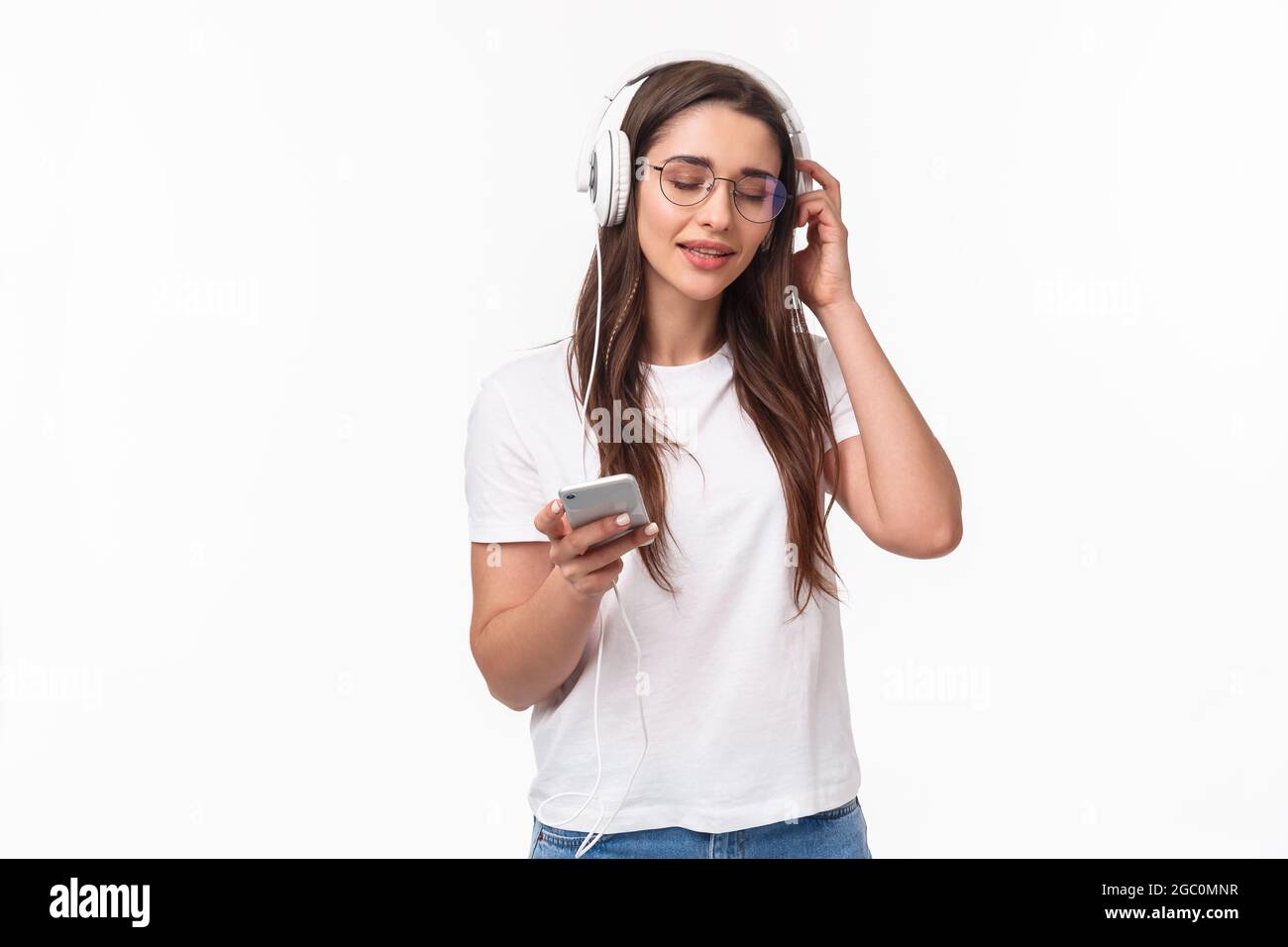 Technology, lifestyle and music concept. Portrait of pleased and ...