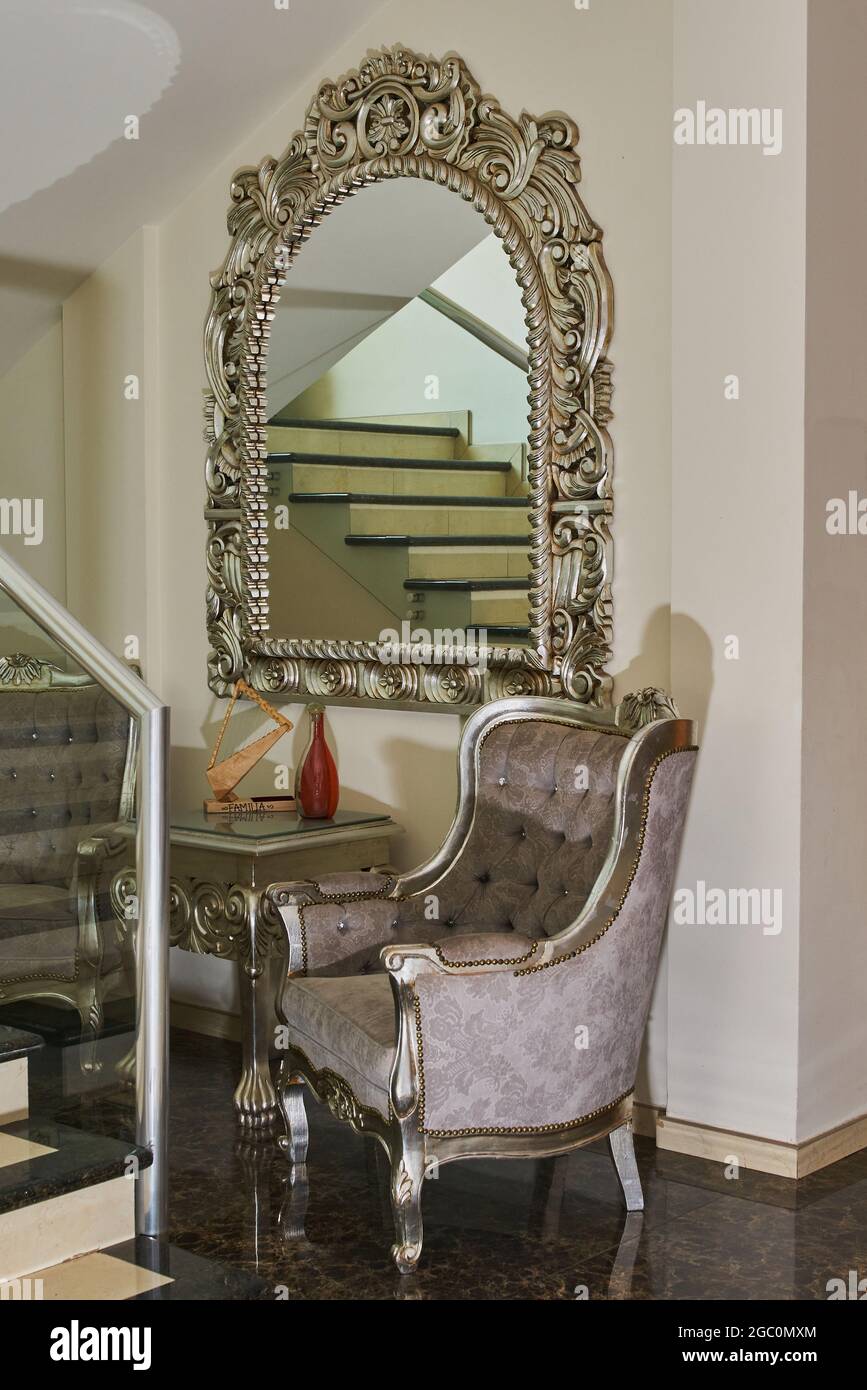 Victorian colonial armchair, near a staircase Stock Photo - Alamy
