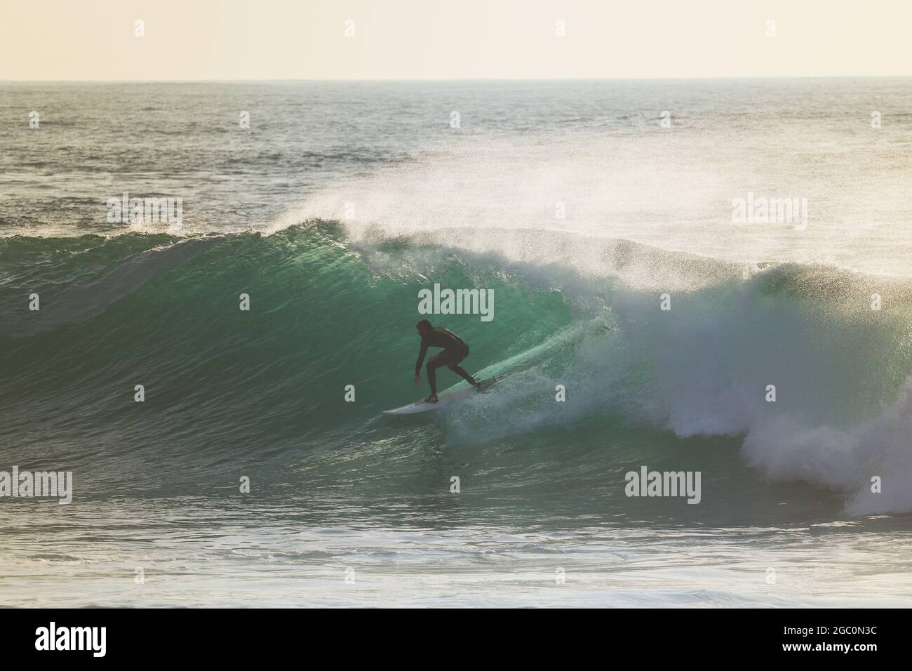 Surfer on Blue Ocean Wave Stock Photo - Alamy