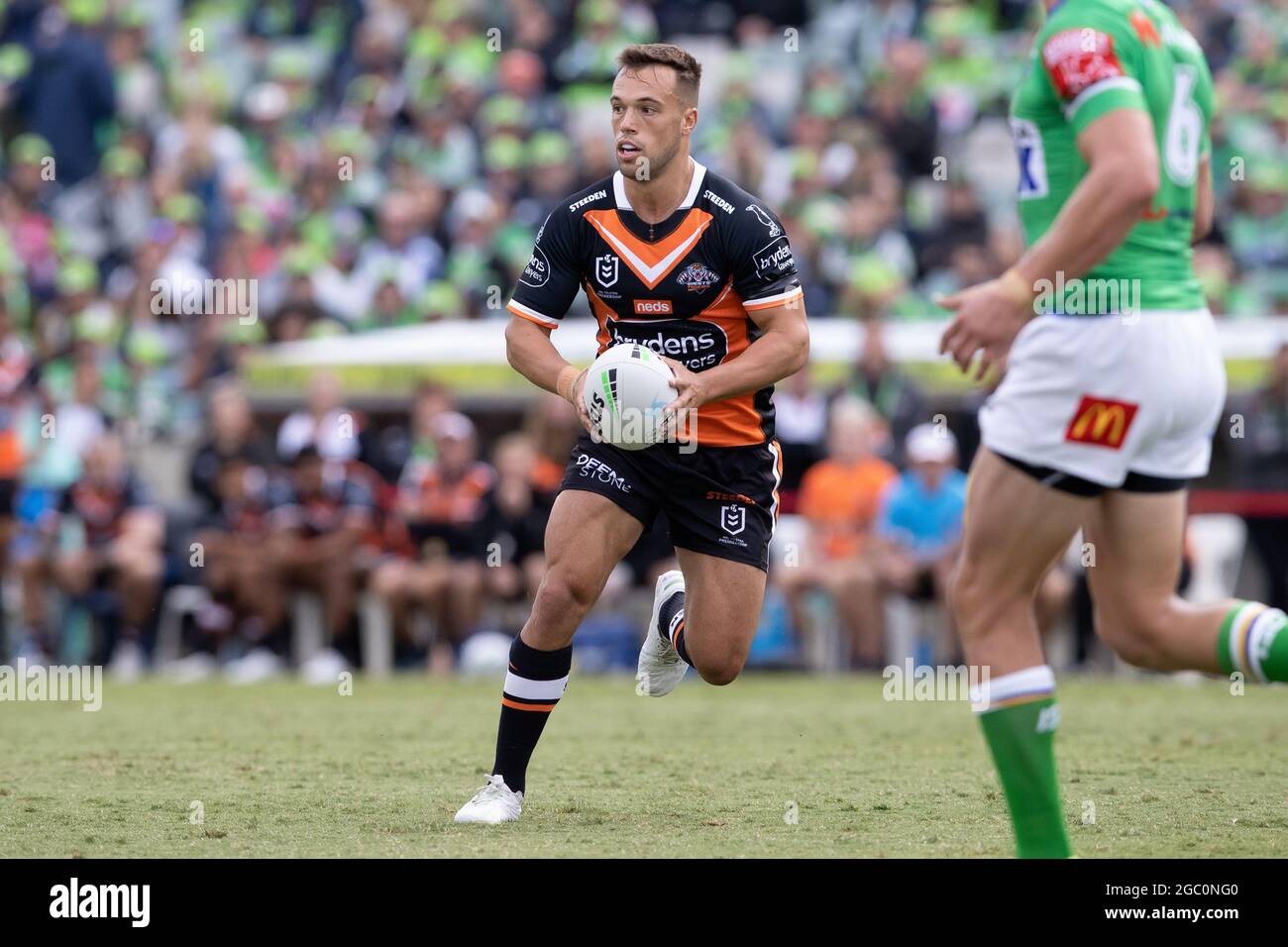 CANBERRA, AUSTRALIA - MARCH 14: Luke Brooks of the Tigers uns the ball ...