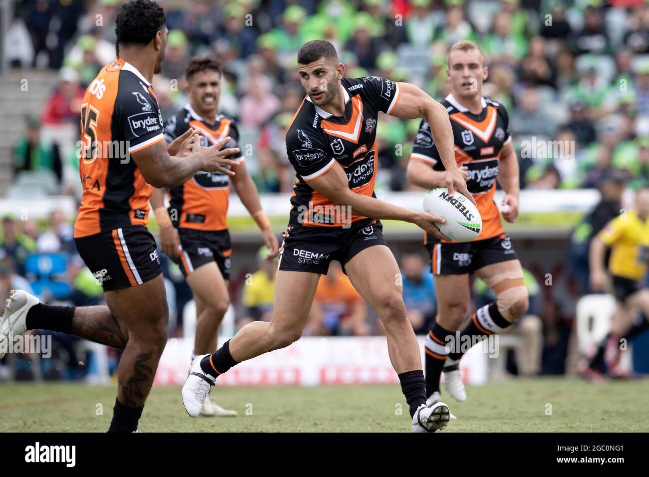 CANBERRA, AUSTRALIA - MARCH 14: Alex Twal of the Tigers passes the ball ...