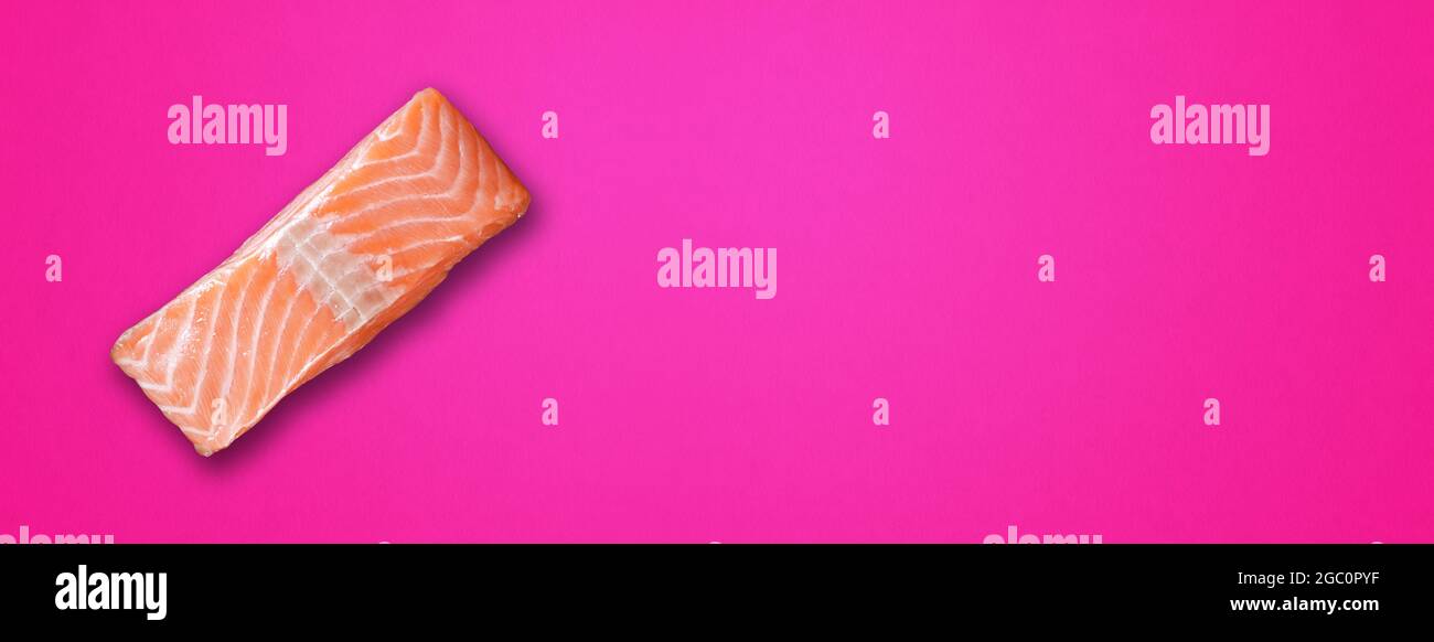 Salmon steak isolated on pink background. Top view. Horizontal banner ...