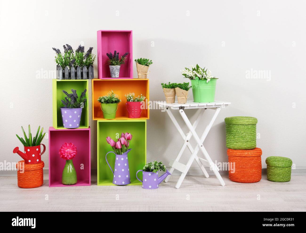 Beautiful colorful shelves with decorative elements standing in room ...