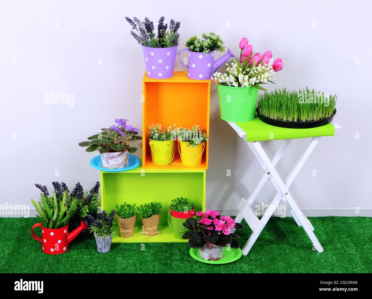 Beautiful colorful shelves and table with decorative elements standing ...