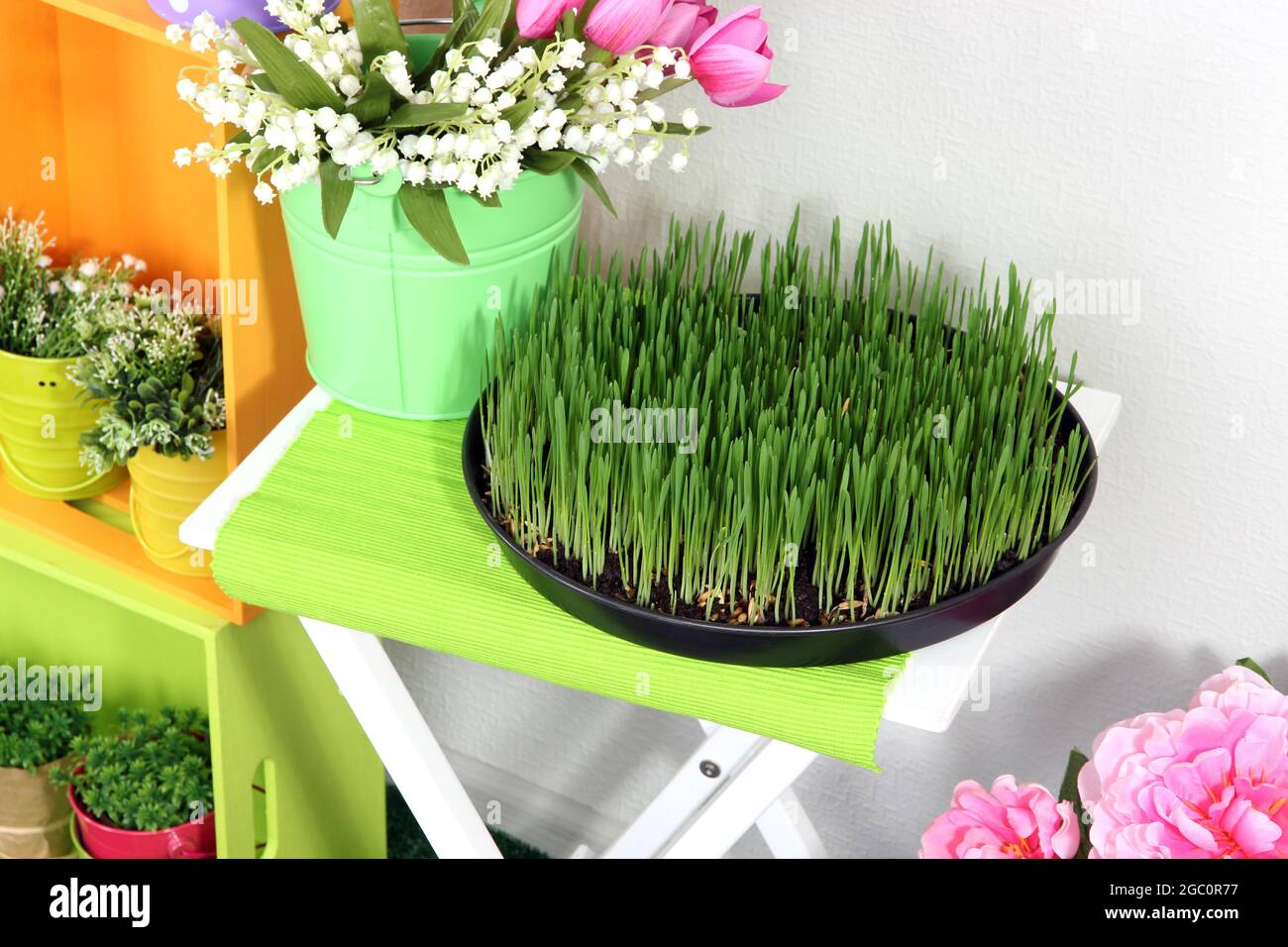 Colorful shelves and table with decorative elements and flowers Stock ...