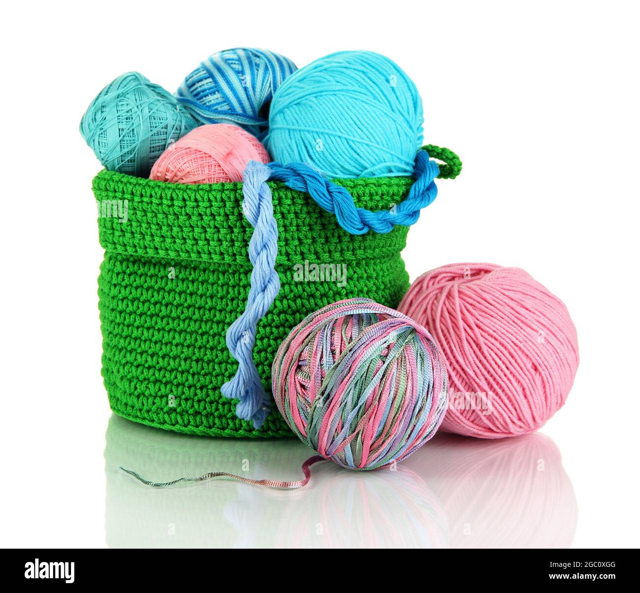 Colorful yarn for knitting in green basket isolated on white Stock ...