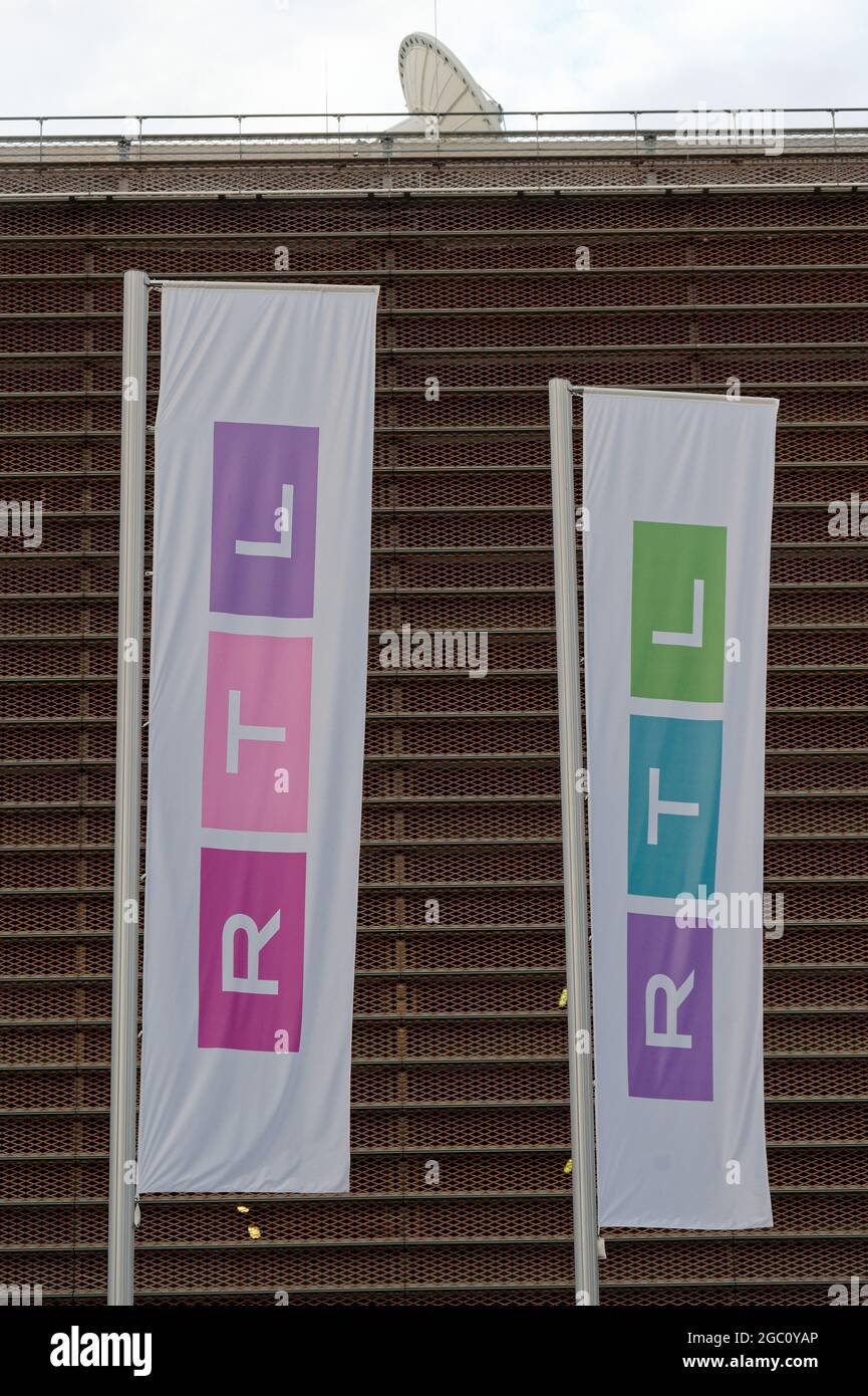 Cologne, Germany. 03rd Aug, 2021. Flags of the TV station RTL stand on ...