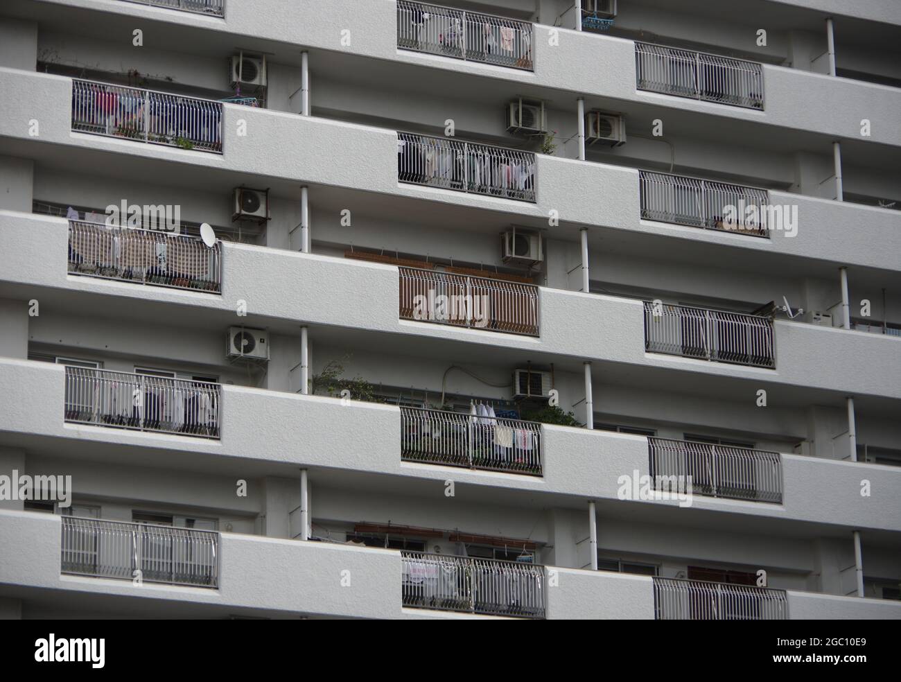 White japanese apartment building facade with air conditioner external ...