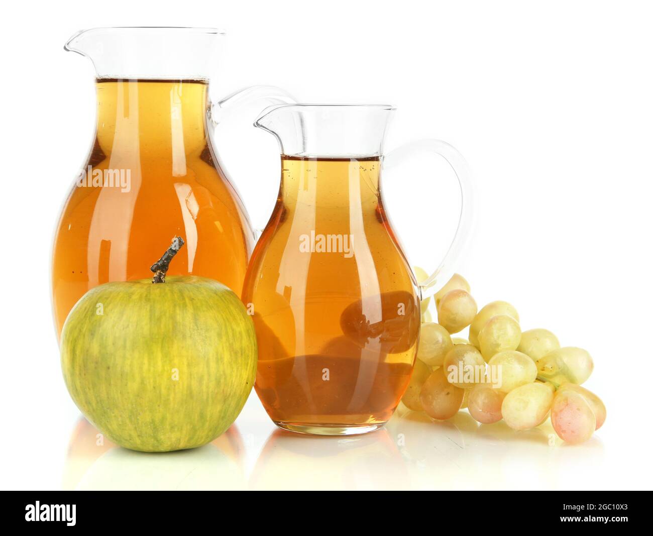 Apple juice in pitchers isolated on white Stock Photo - Alamy