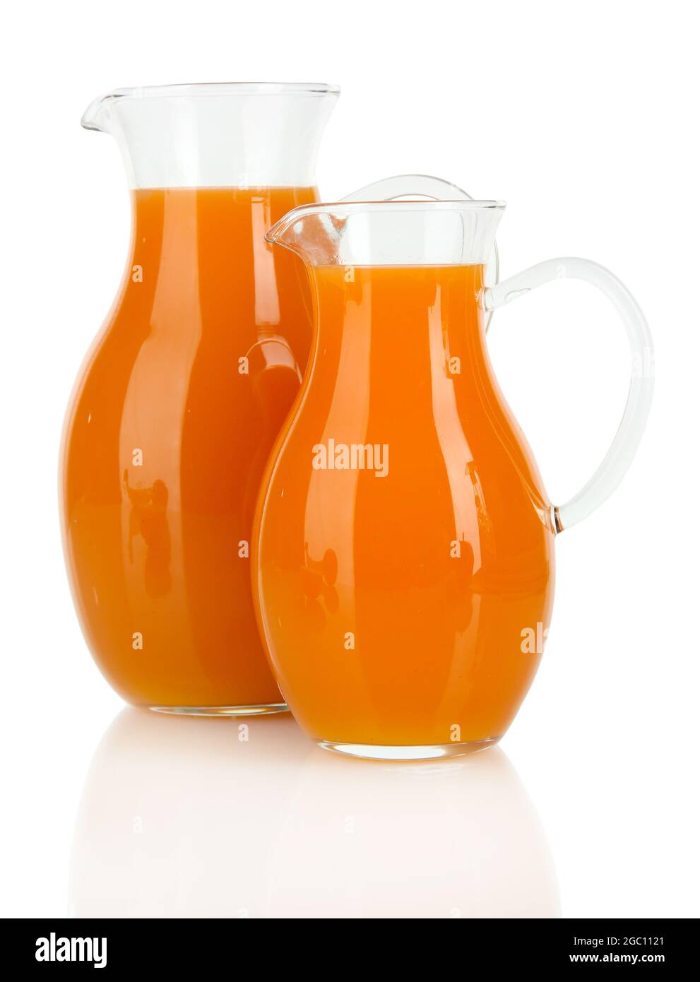 Orange juice in pitchers isolated on white Stock Photo - Alamy