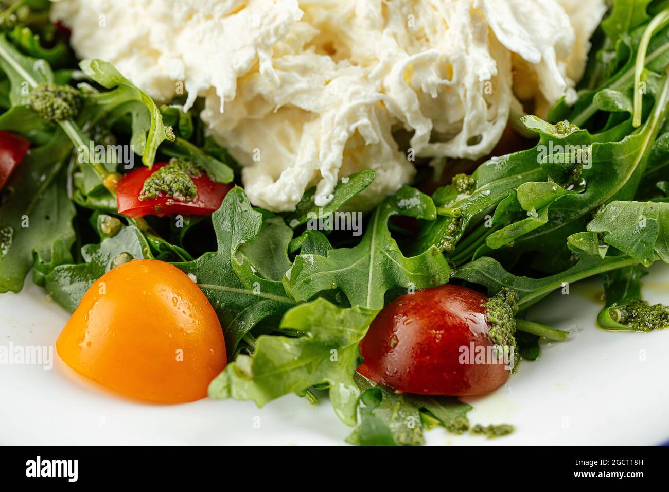 Burrata cheese arugula salad Stock Photo - Alamy