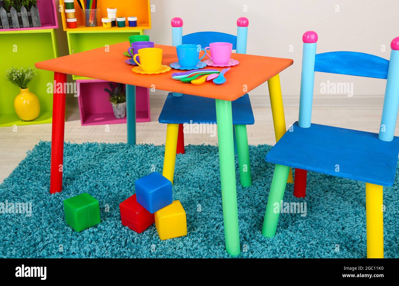 Small and colorful table and chairs for little kids Stock Photo - Alamy