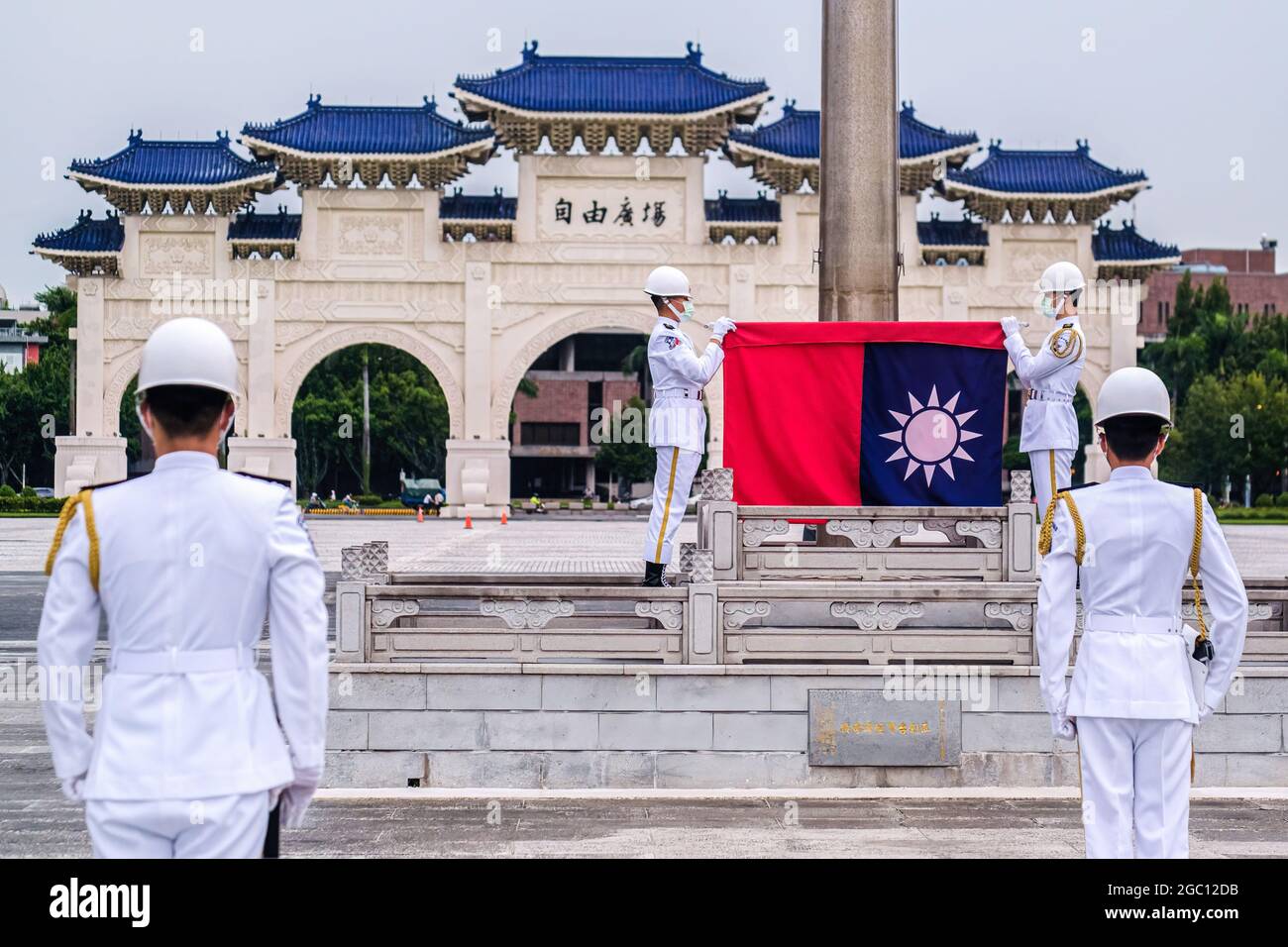 Taiwanese honor guards fold a Flag of Taiwan during a Flag Lowering ...