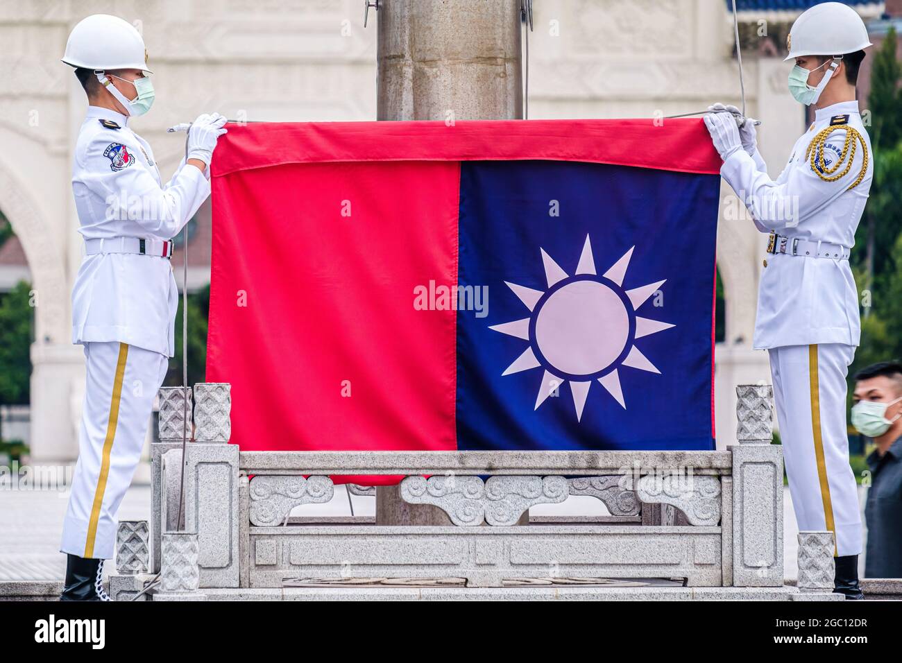 Taiwanese honor guards fold a Flag of Taiwan during a Flag Lowering ...