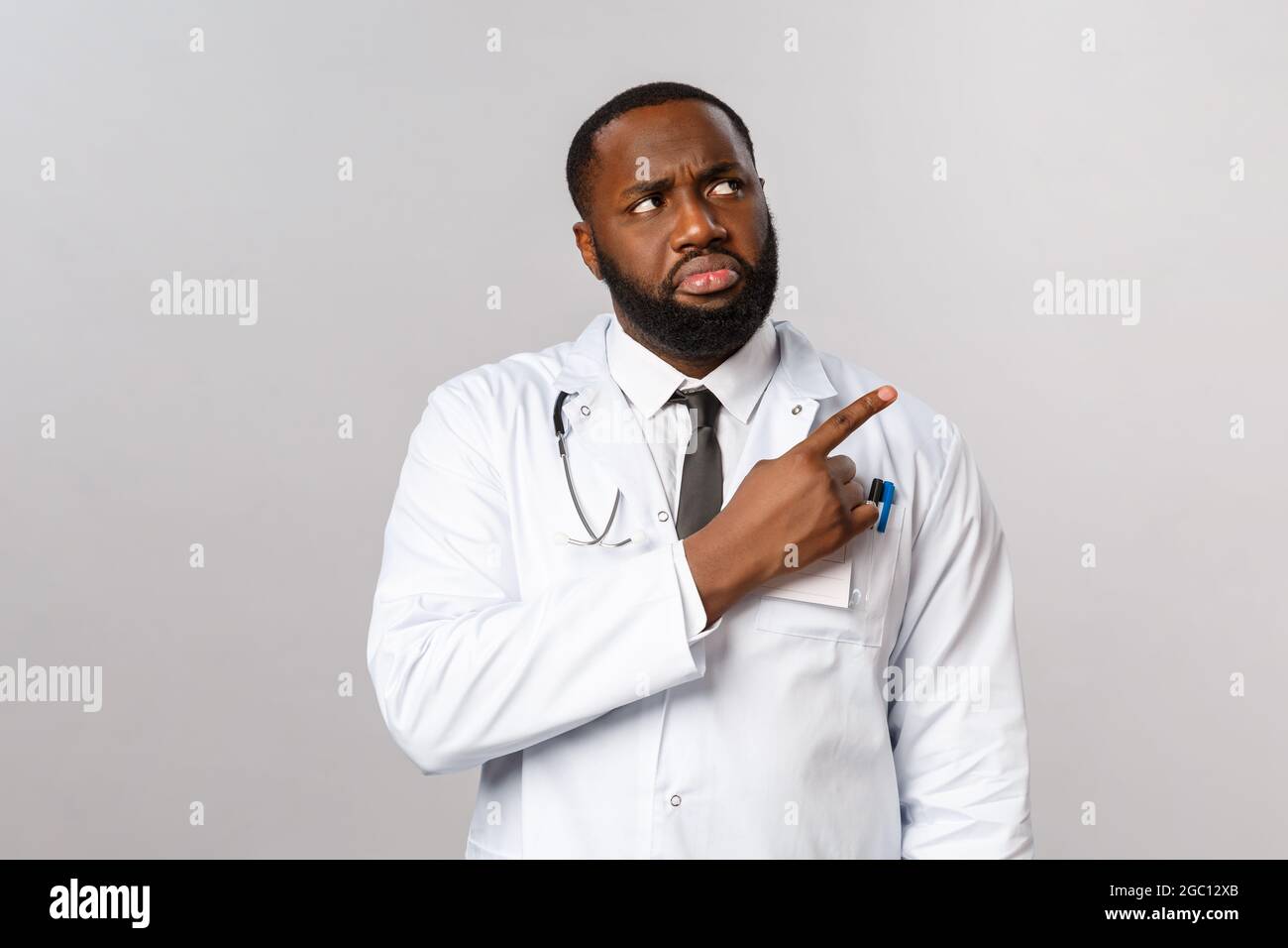 Healthcare, medicine and epidemic concept. Skeptical and displeased ...