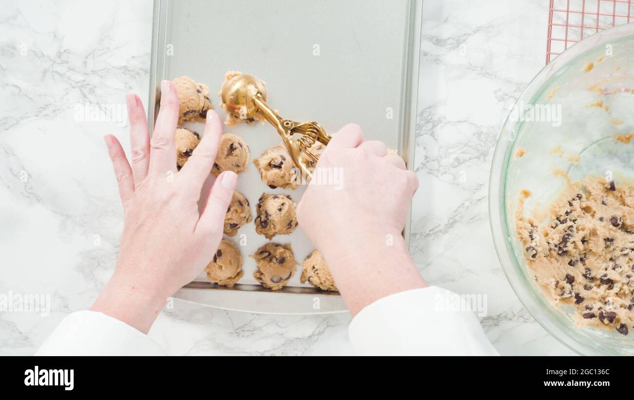 Step by step. Flat lay. Scooping homemade chocolate chip cookies with ...