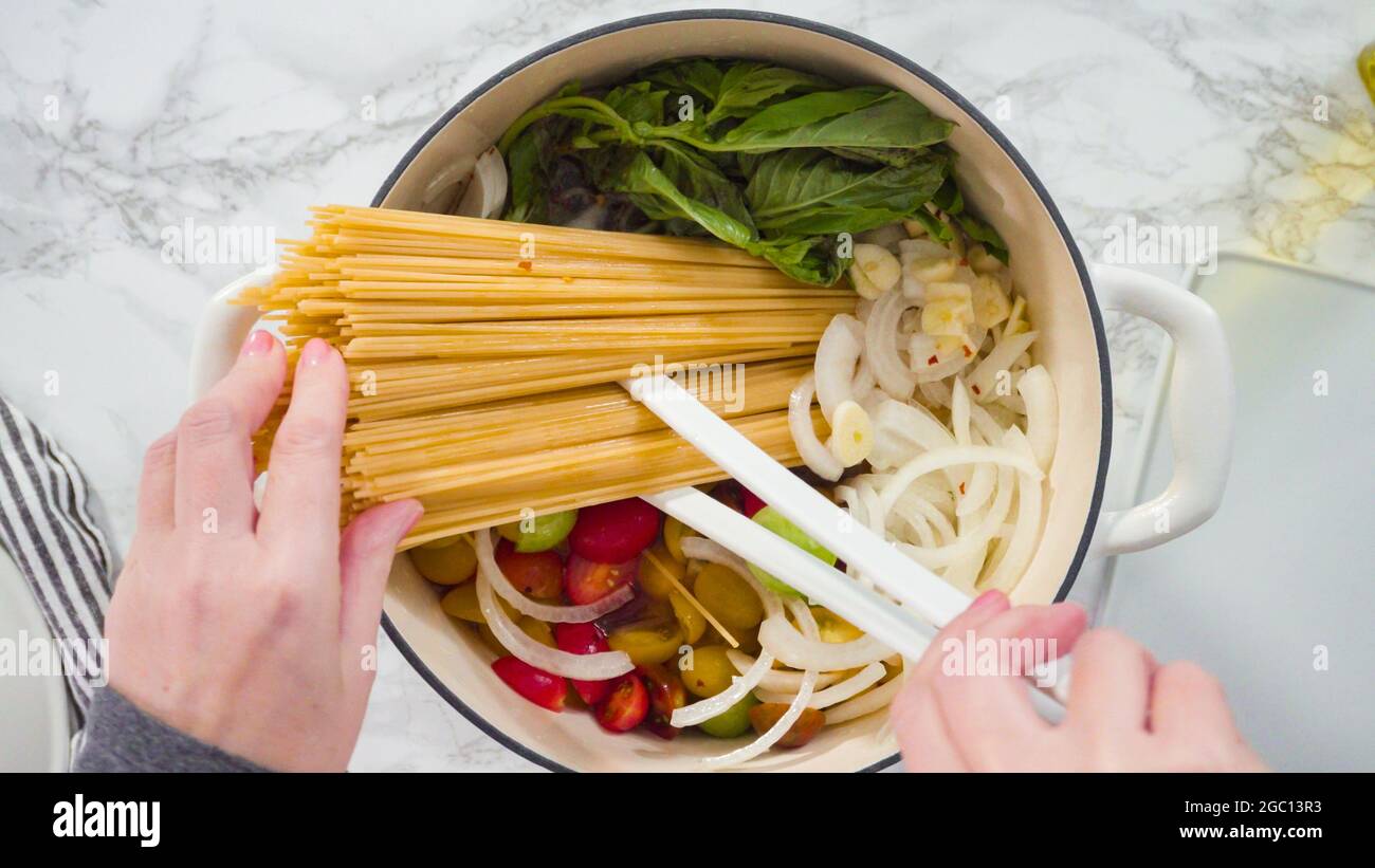 Flat lay. Step by step. Cooking on pot pasta recipe in an enameled cast ...