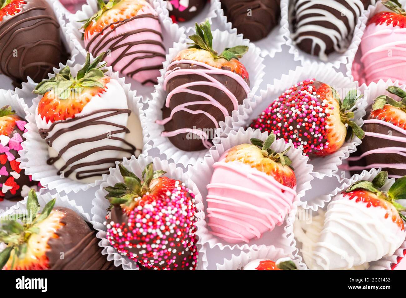 Variety of chocolate dipped strawberries in a heart-shaped box Stock ...
