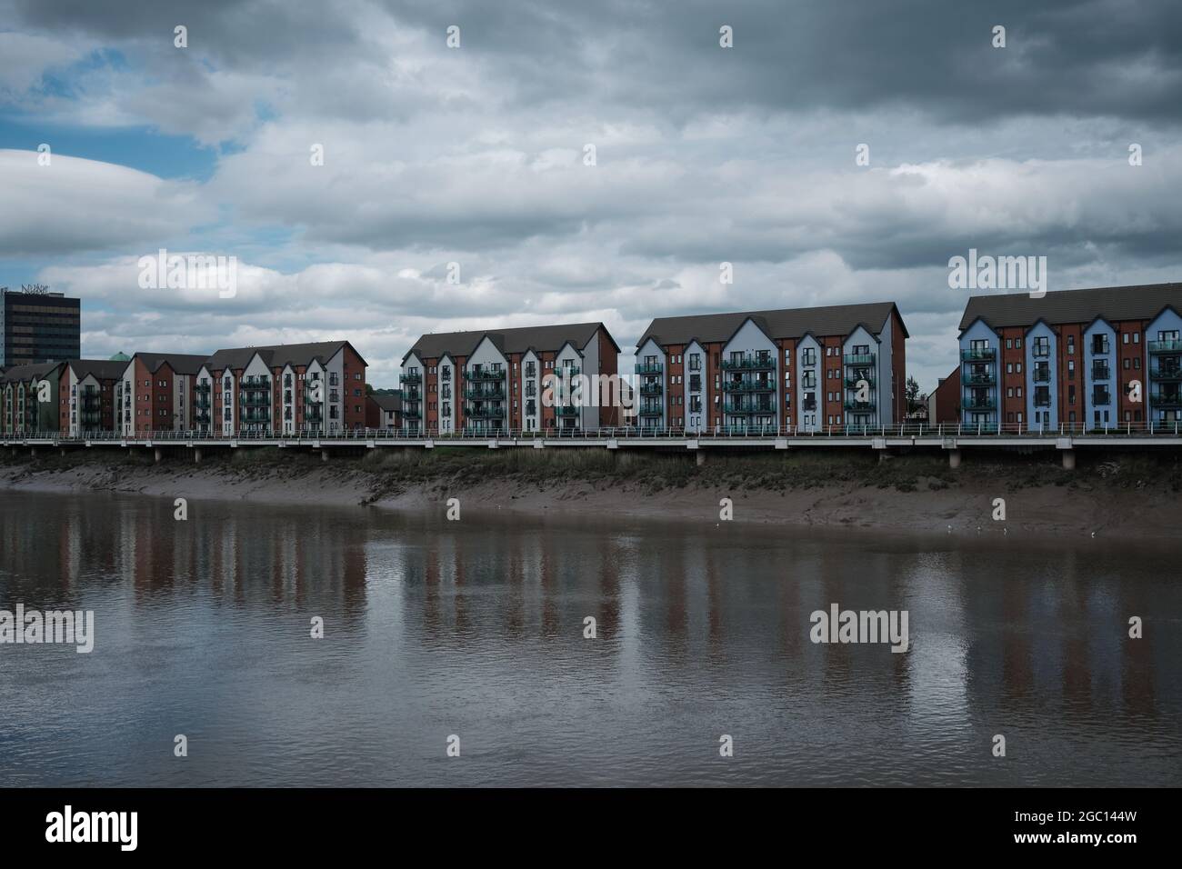 modern housing development on a river bank Stock Photo - Alamy