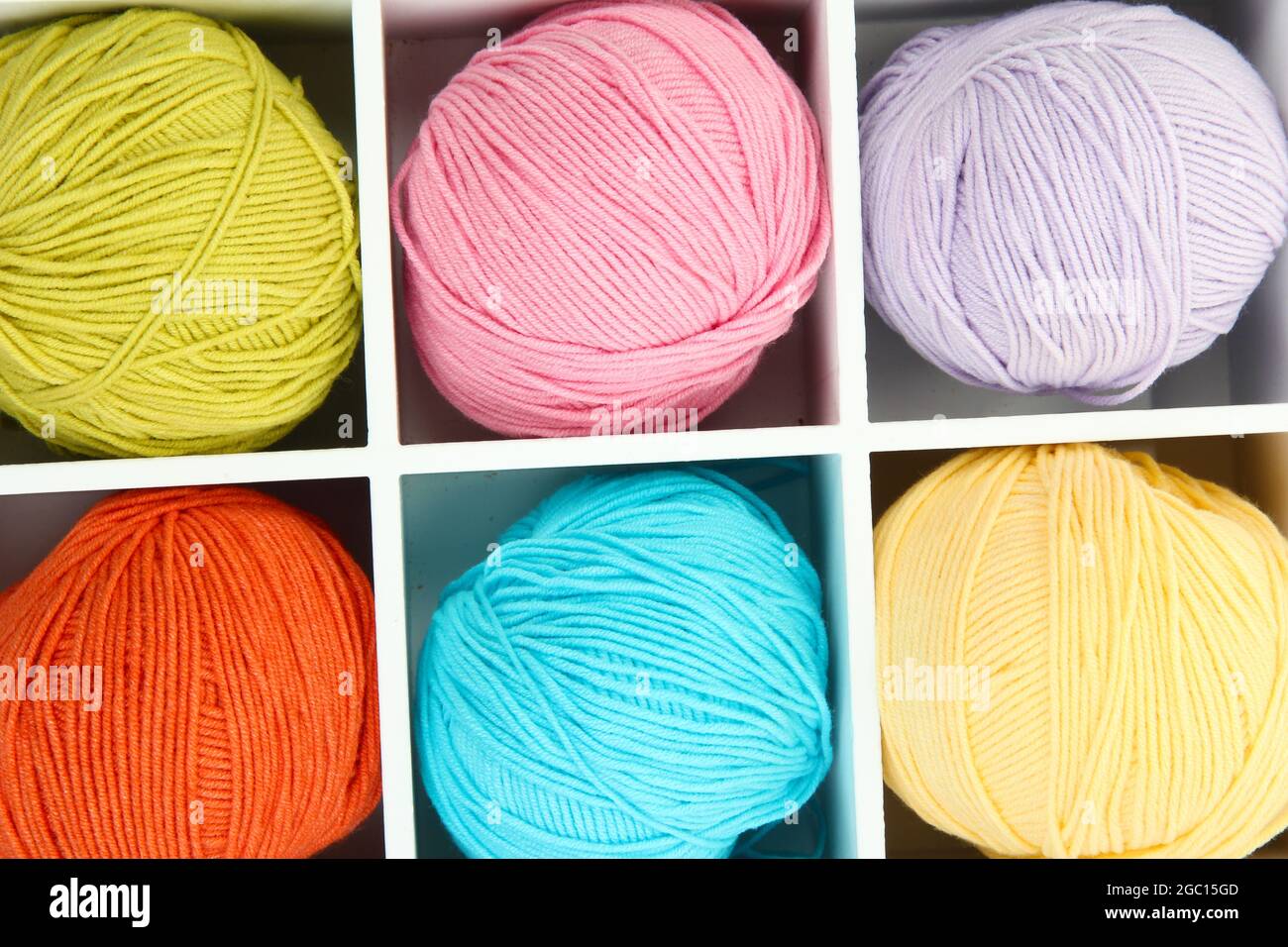 Material for knitting in white wooden box closeup Stock Photo - Alamy