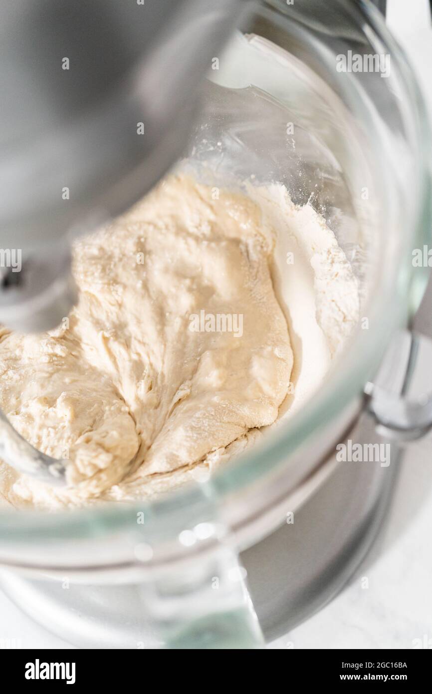 Mixing bread dough in a stand-alone kitchen mixer to bake patriotic ...