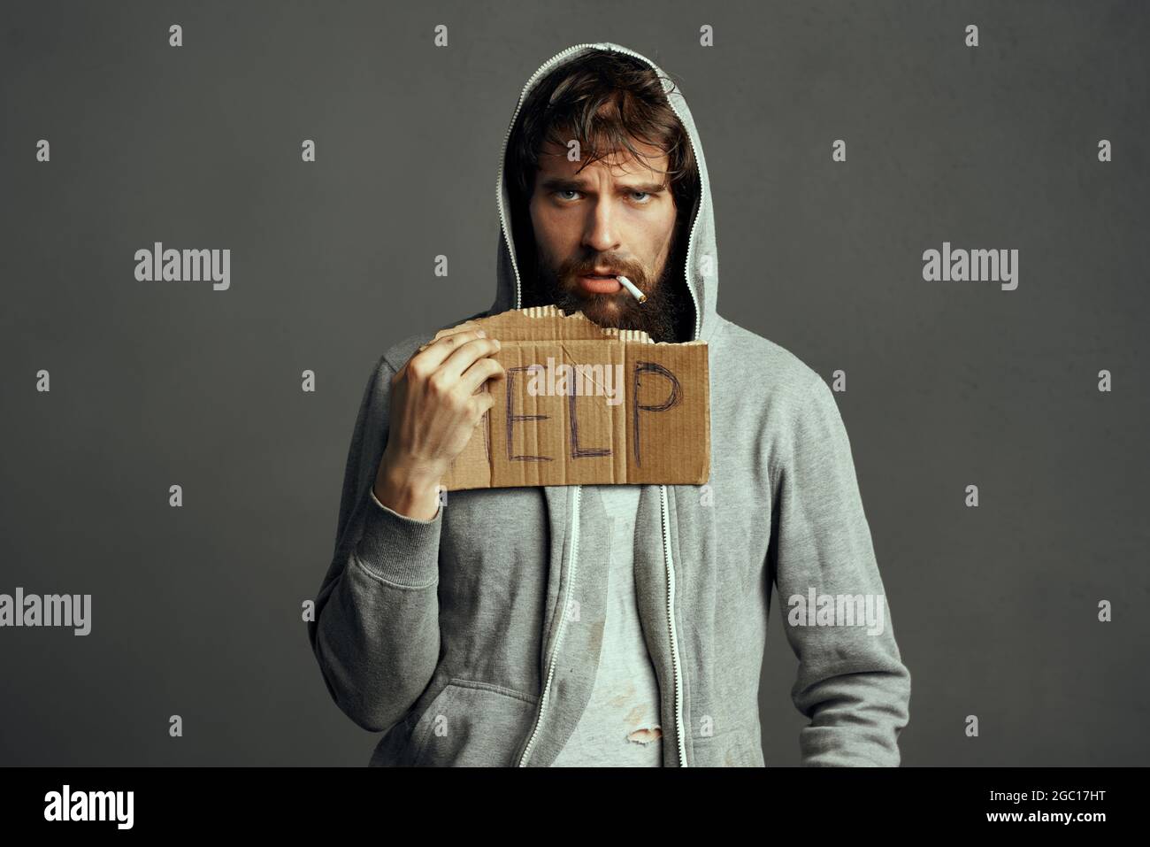 homeless man with beard emotions beggar Stock Photo - Alamy