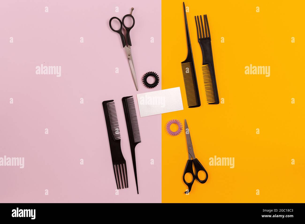 Hairdresser tools on pink and orange background with copy space Stock ...