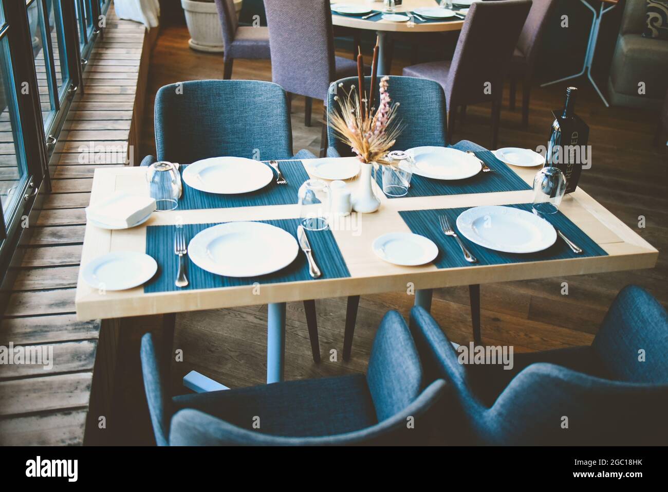 Tables set for meal Stock Photo - Alamy