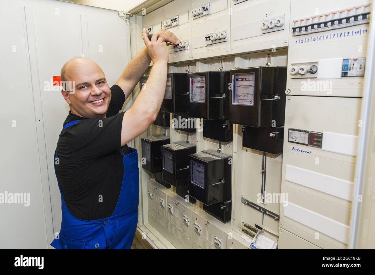 electrician at the distribution cabinet Stock Photo - Alamy