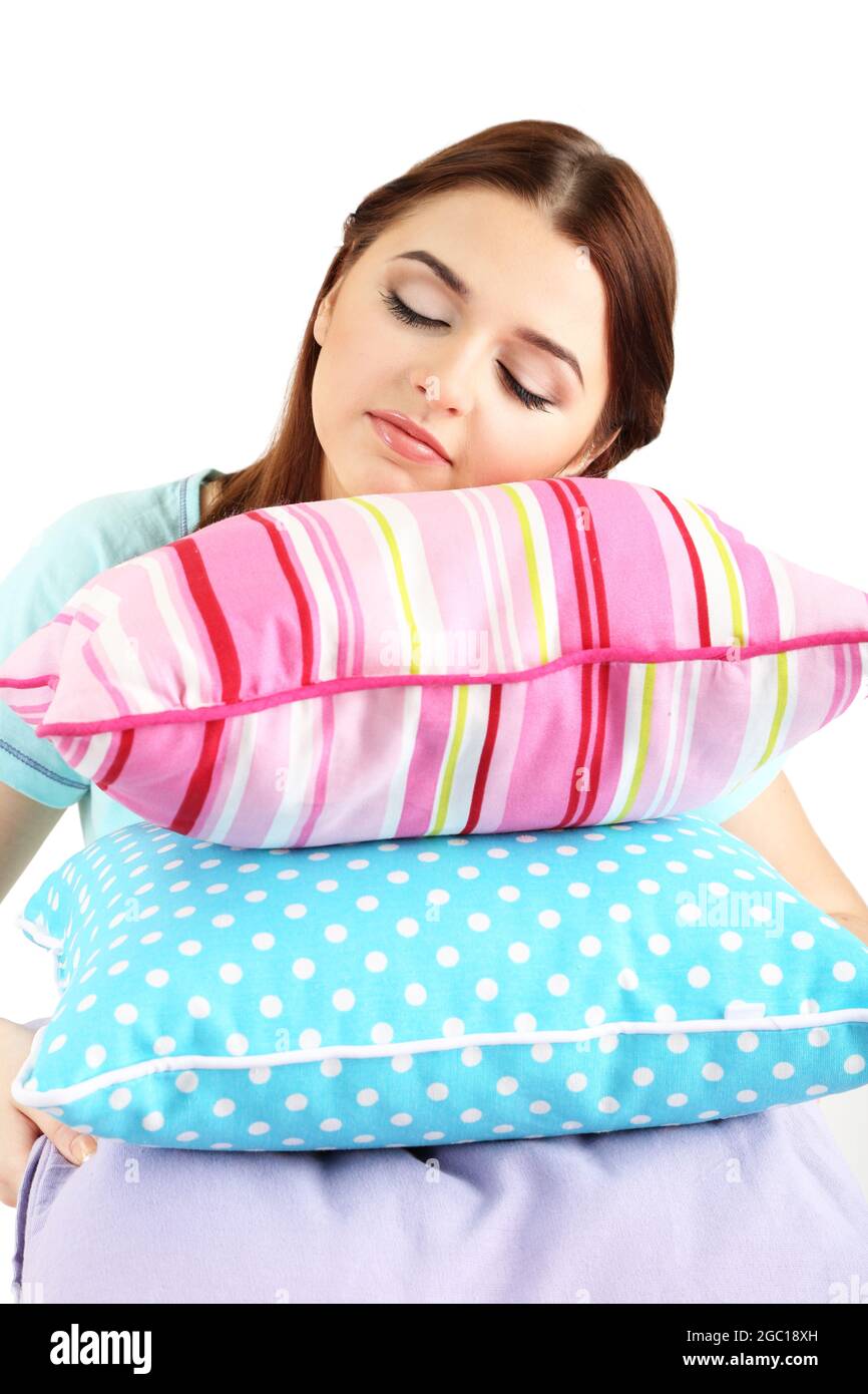 Beautiful young girl with pillows isolated on white Stock Photo - Alamy