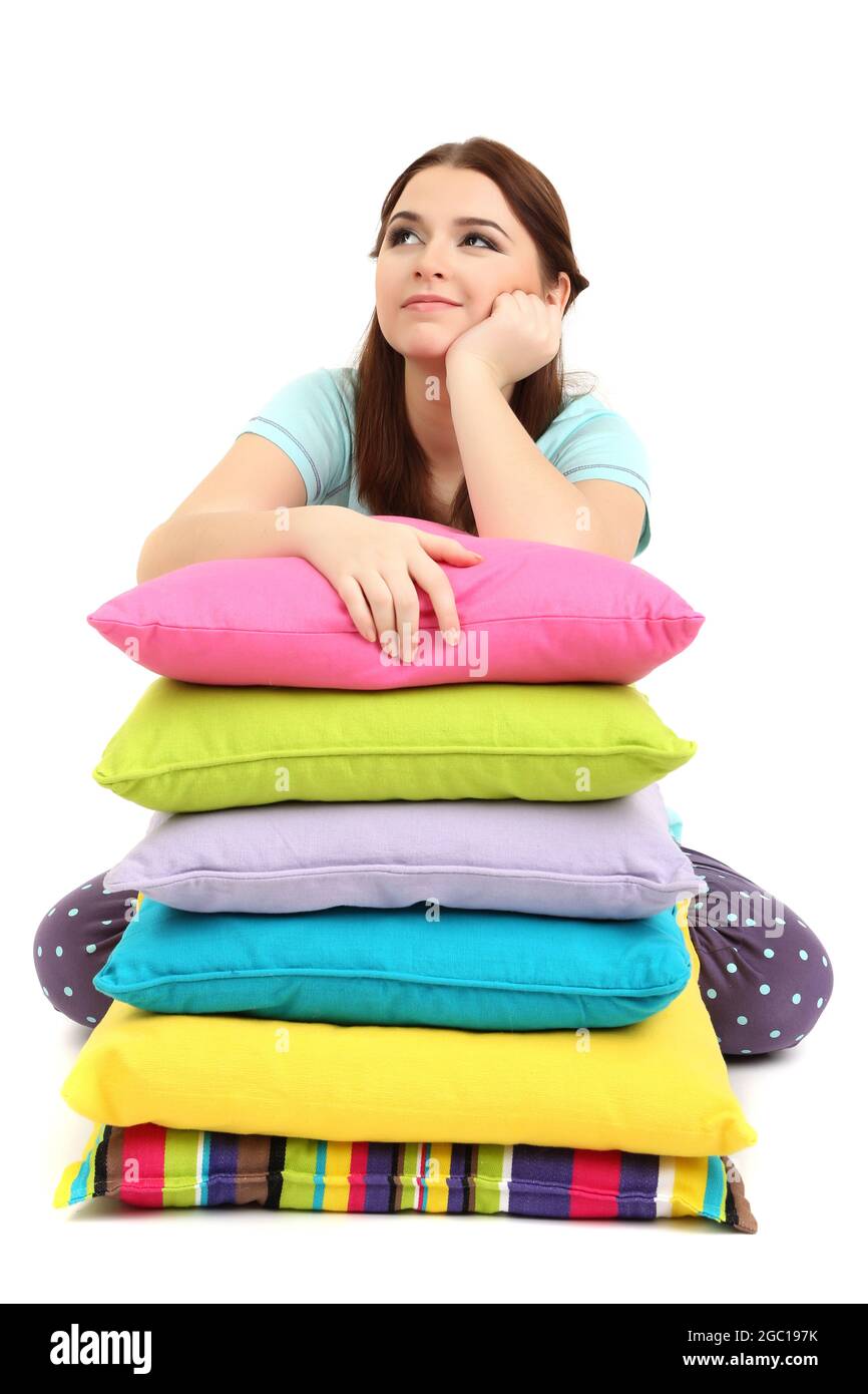 Beautiful young girl with pillows isolated on white Stock Photo - Alamy