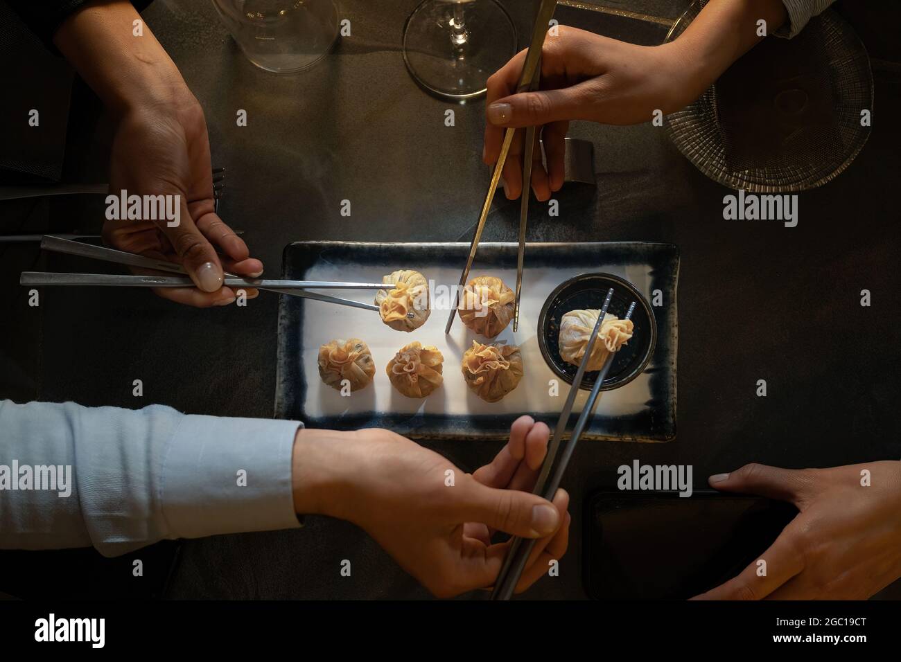 Closeup on dim sum, Chinese food disposed on a plate with group of ...