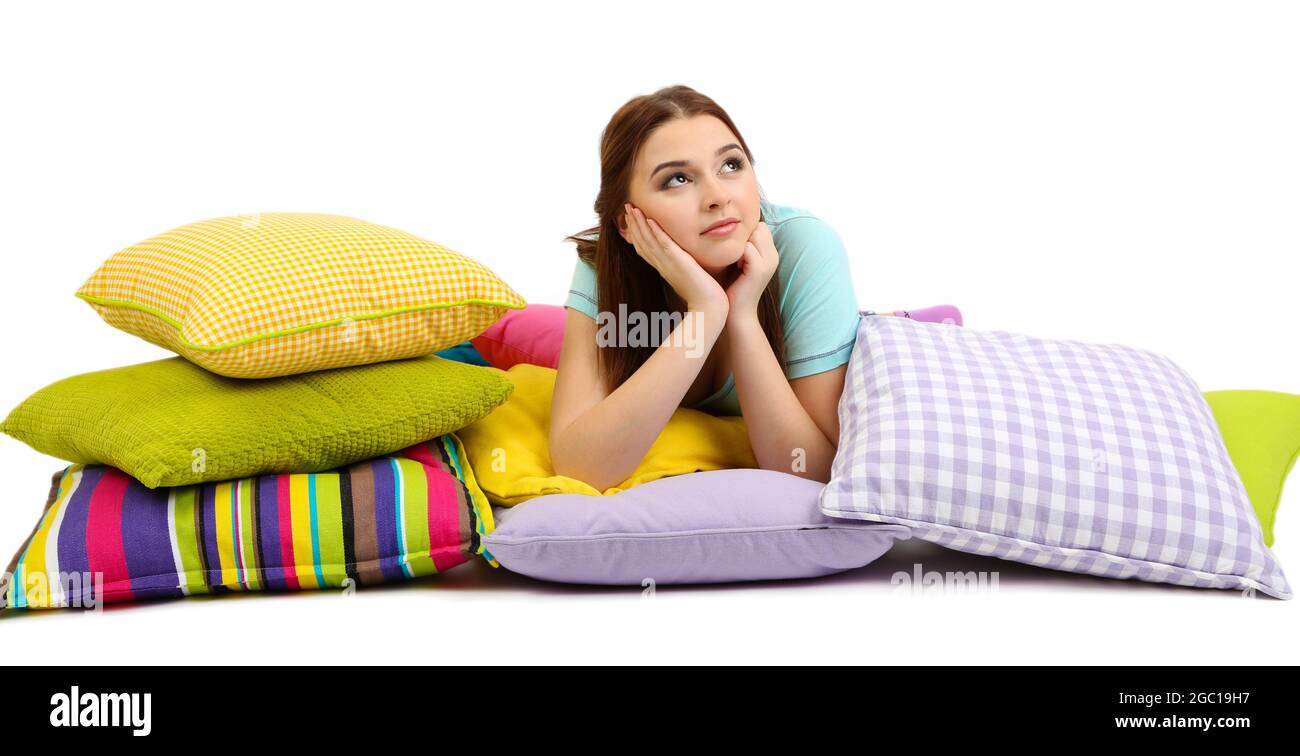 Beautiful young girl with pillows isolated on white Stock Photo - Alamy