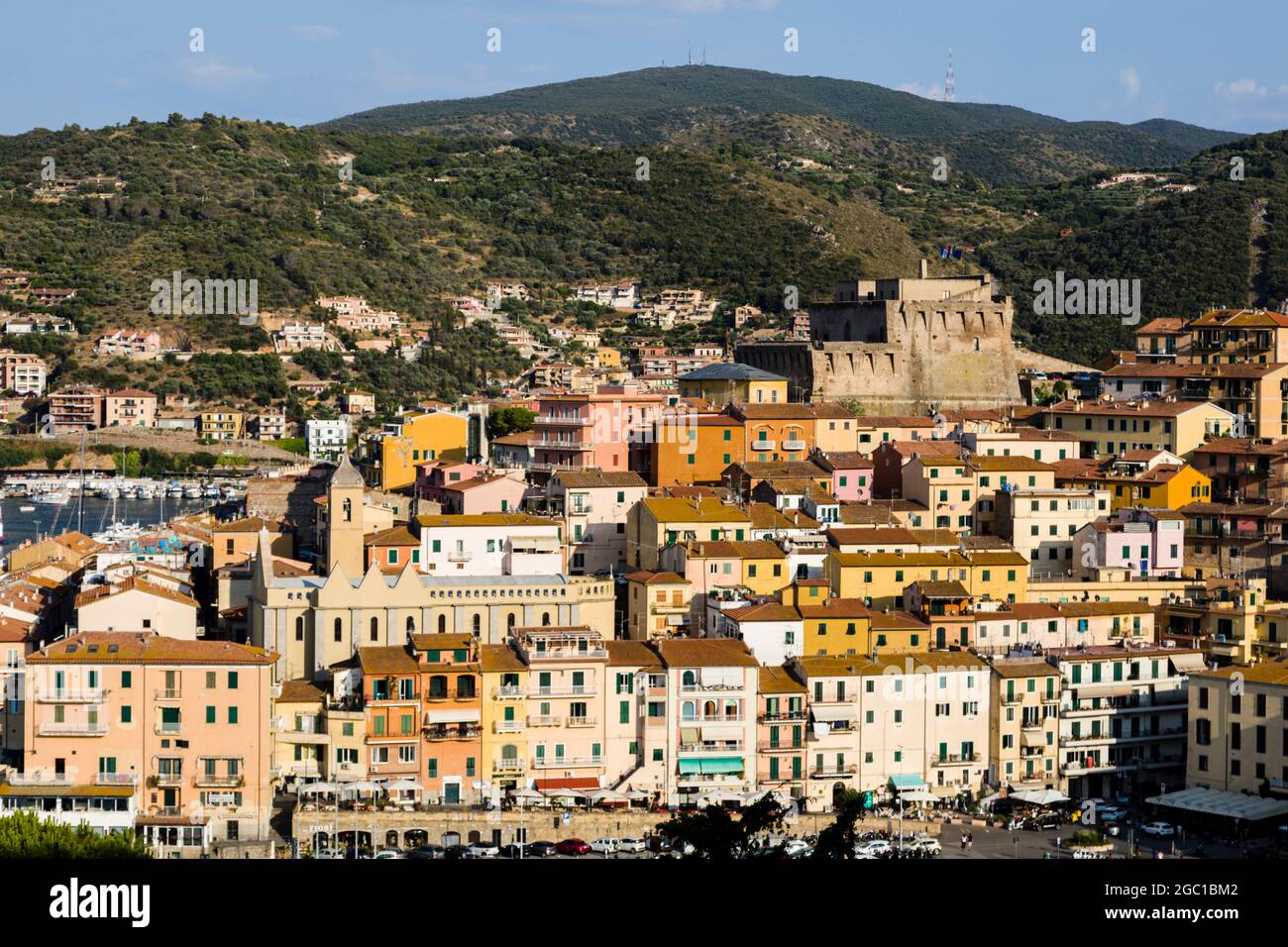 Houses overlooking the harbour in Porto Santo Stefano, one of the two ...